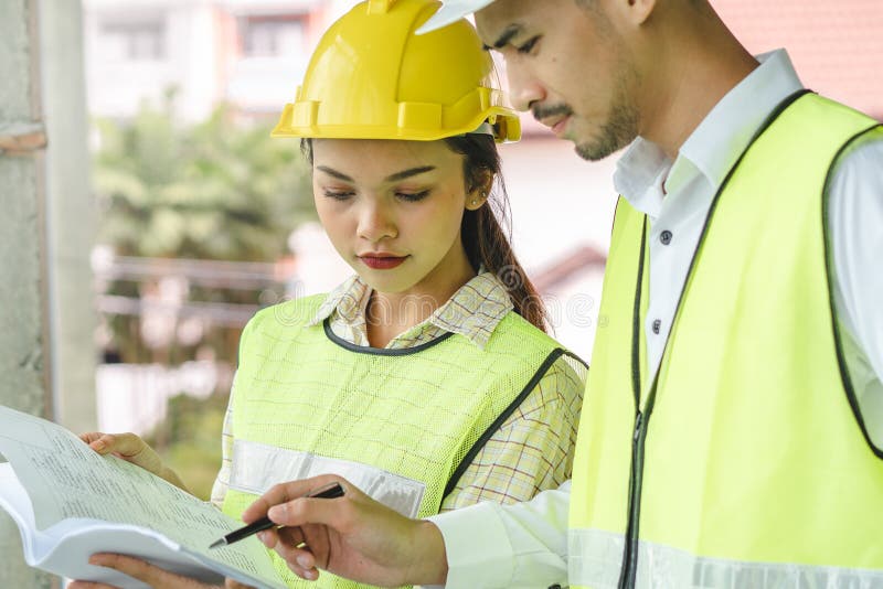 Builder Consultancy. Two Engineer Consulting and Checking Material and ...