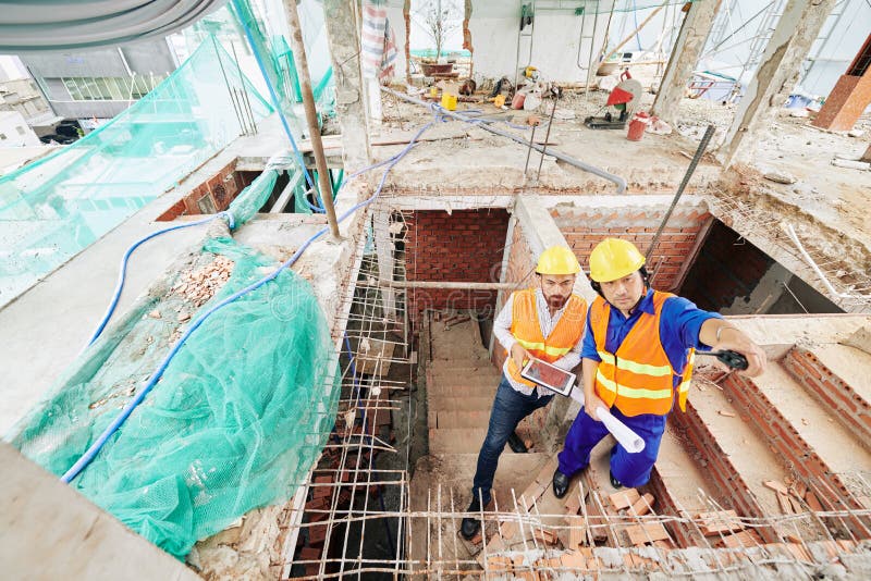 Builder and Contractor on Construction Site Stock Photo - Image of site ...