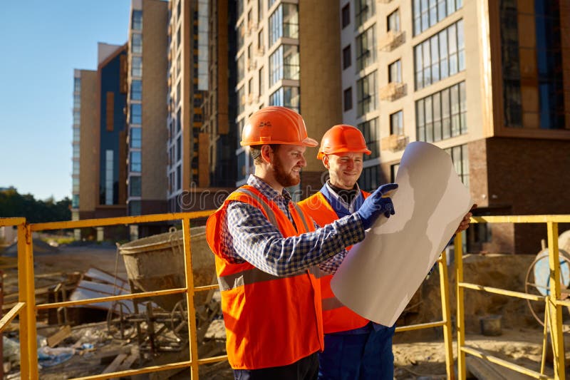 Builder Contractor and Engineer Architect Discussing Blueprint Stock ...