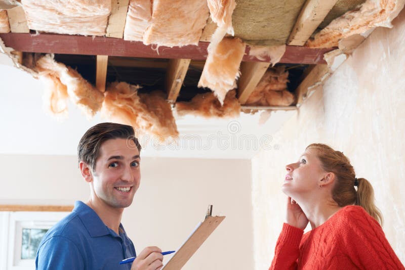 Builder and Customer Discussing Ceiling Repair Stock Photo - Image of ...