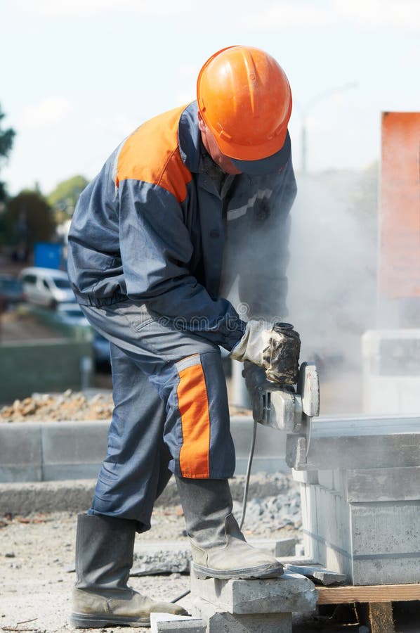 Builder at Cutting Curb Work Stock Photo - Image of industry, helmet ...