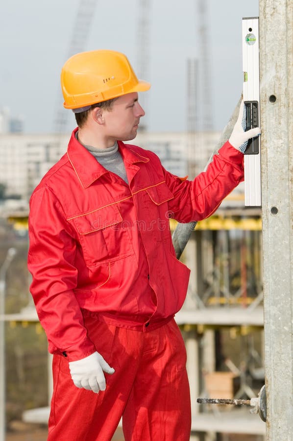 Builder with digital level stock photo. Image of carpenter - 16725706