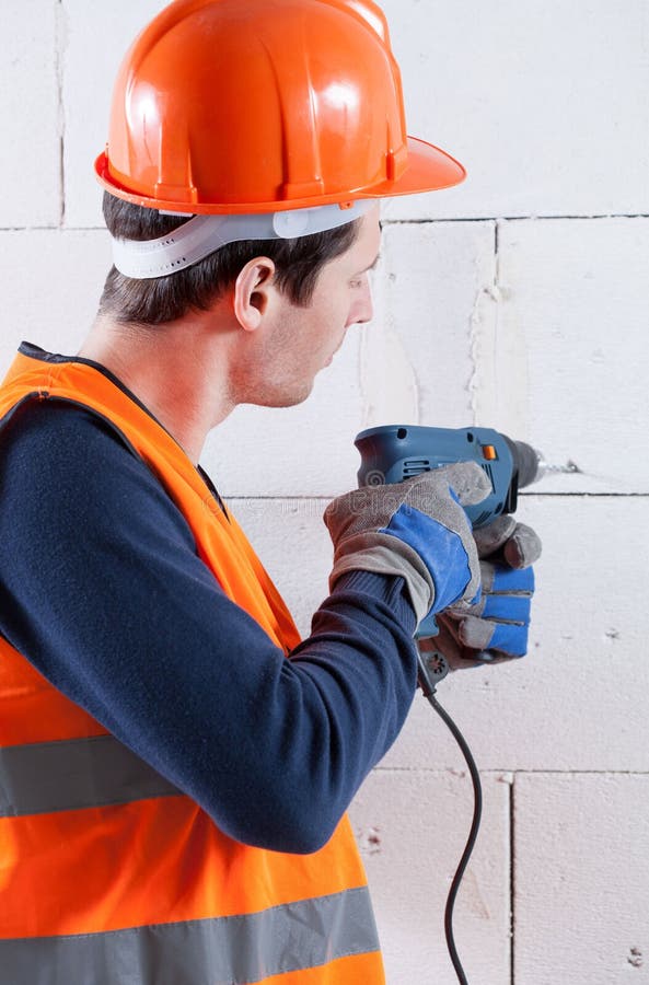 Builder Drilling Brick Wall Stock Image - Image of manual, construction ...