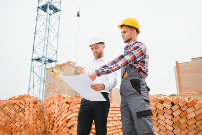 Builder and Engineer on Construction Site Stock Image - Image of ...