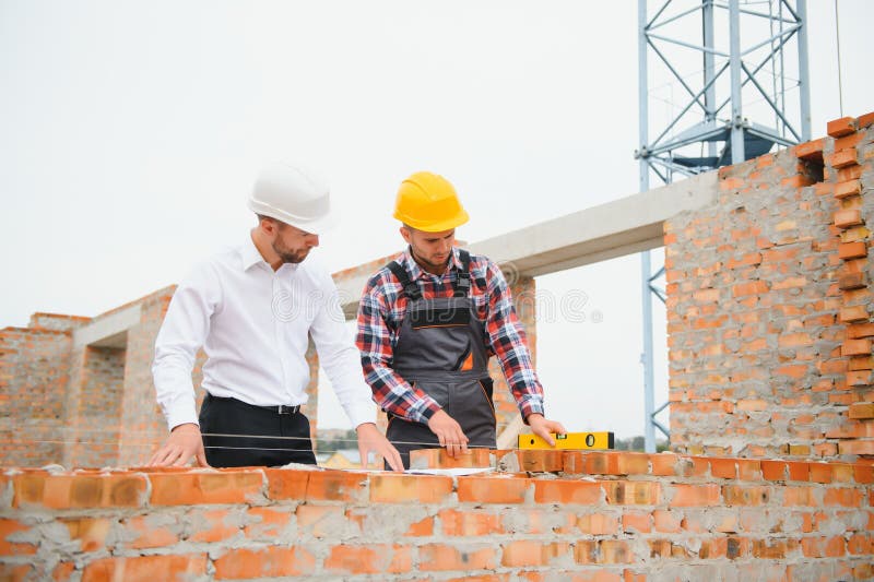 Builder and Engineer on Construction Site Stock Photo - Image of ...