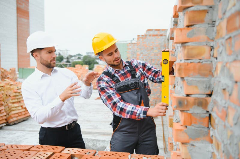 Builder and Engineer on Construction Site Stock Photo - Image of ...