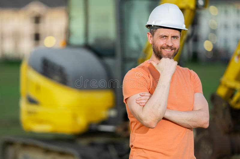 Builder on Excavator. Builder Worker with Excavator. Builder in Helmet ...