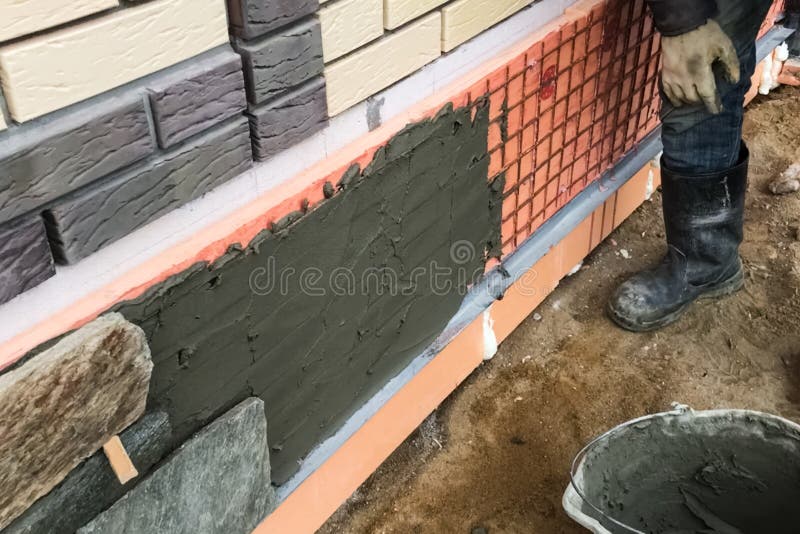 Builder Faces the Basement of a House with a Wild Stone. Flat Fo Stock ...