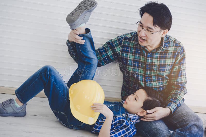 Builder Father Teaching His Son on Construction Work and Poiting To the ...