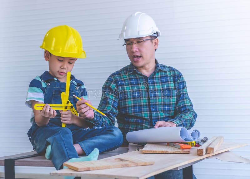 Father Teaching His Son To Fo the DIY Home Improvement Work for Parent ...