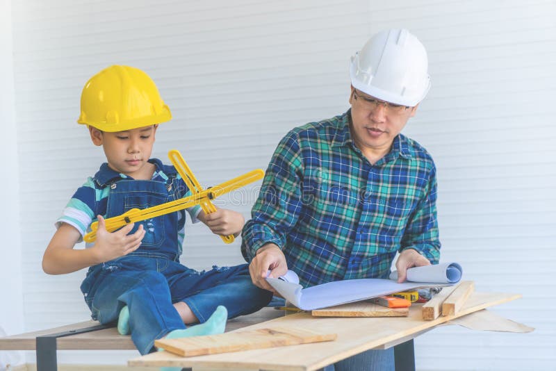 Father Teaching His Son To Fo the DIY Home Improvement Work for Parent ...