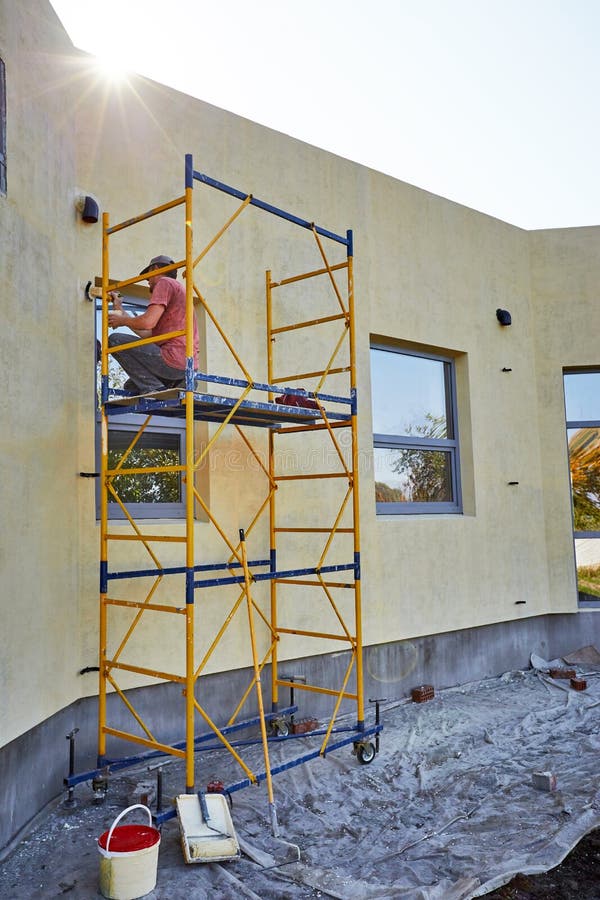 Builder at the Finish House Working with the Tool. Stock Image - Image ...