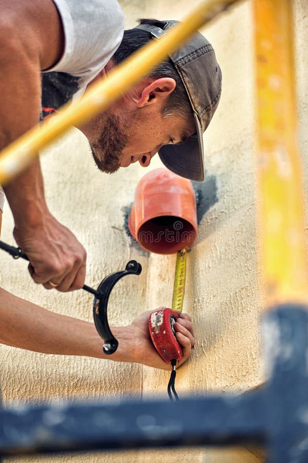 Builder at the Finish House Working with the Tool. Stock Photo - Image ...