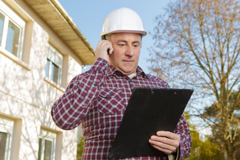 Builder Foreman Making Call Stock Photo - Image of hard, worker: 99461172