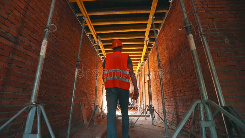 The Builder Goes Inside the Building Under Construction. the Builder ...