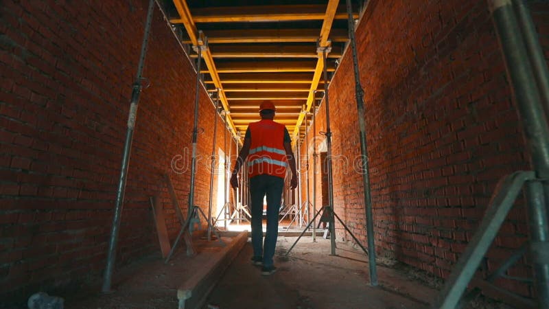 The Builder Goes Inside the Building Under Construction. the Builder ...