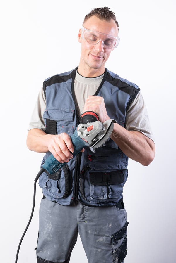 The Builder in Goggles, with an Angle Grinder in His Hands Stock Image ...