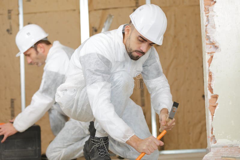 Builder with hammer stock photo. Image of hammer, drill - 258798088