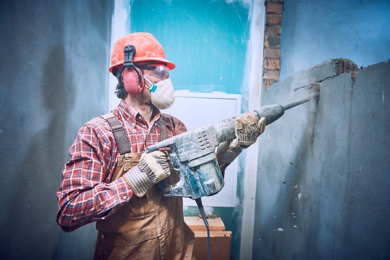 Worker with Demolition Hammer Breaking Interior Wall Stock Image ...