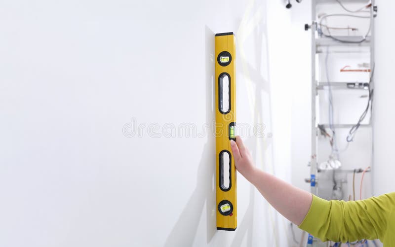 Man Measures on Wall with Ruler Stock Image - Image of renovation, wall ...