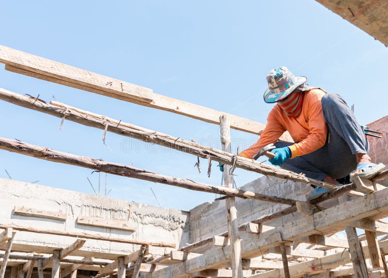 Builder Hands Hammering a Nail into a Formwork Support Second Floor ...