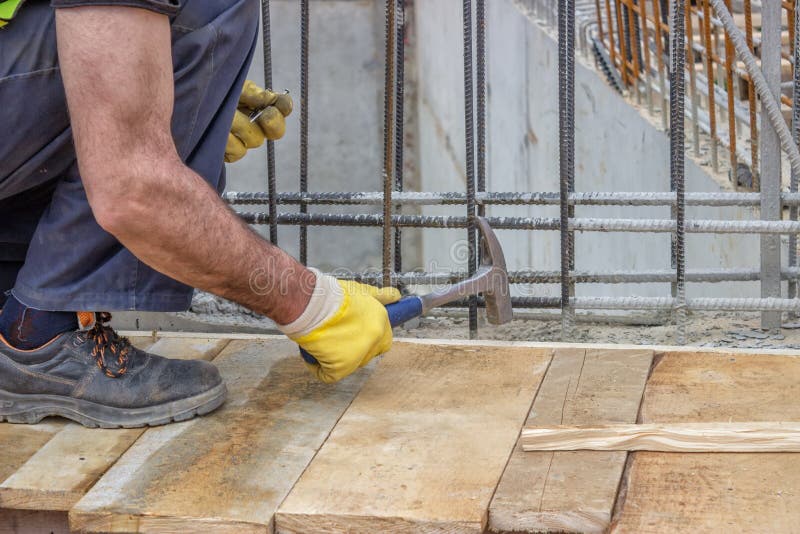 Builder Hands Hammering a Nail into a Plank 3 Stock Image - Image of ...