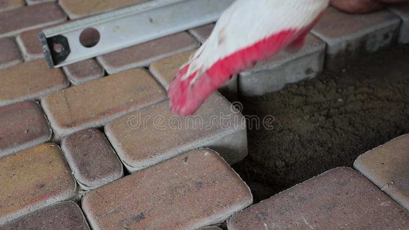 A Master Mason is Laying a Red Brick Wall. the Master at the ...