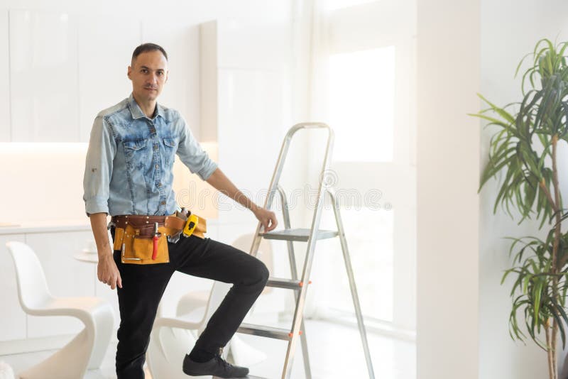 Builder Handyman with Construction Tools. House Renovation Background ...