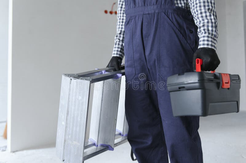 Builder Handyman with Construction Tools. House Renovation Background ...