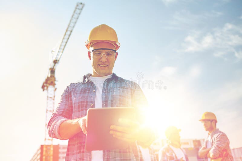 Builder in Hardhat with Tablet Pc at Construction Stock Photo - Image ...