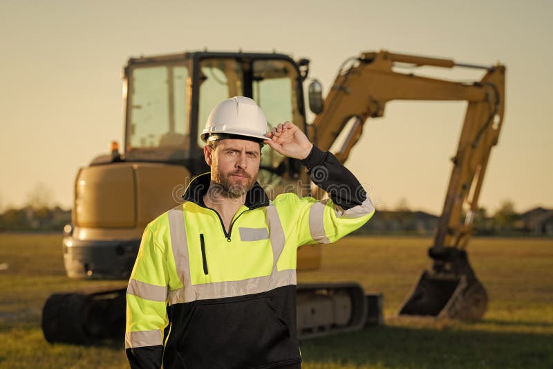 Builder in Helmet on the Construction Site. Stock Photo - Image of ...