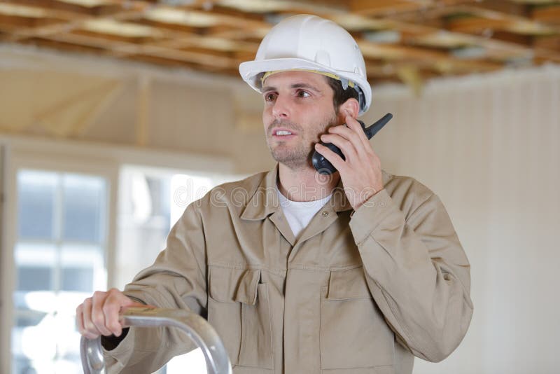Builder in Helmet with with Walkie Talkie Stock Image - Image of ...