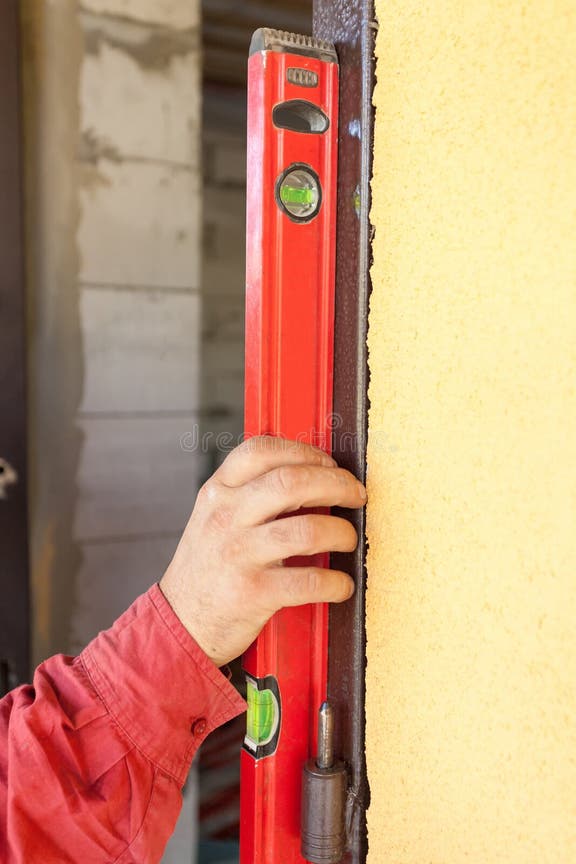Builder Holding a Builders Level. Stock Photo - Image of competence ...
