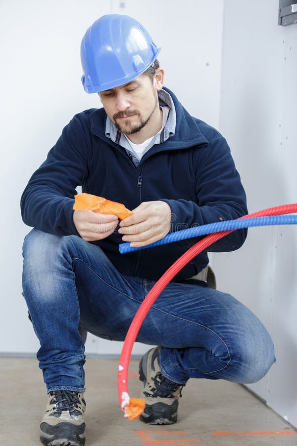 Builder Holding Cables Taped Together Stock Image - Image of wire ...