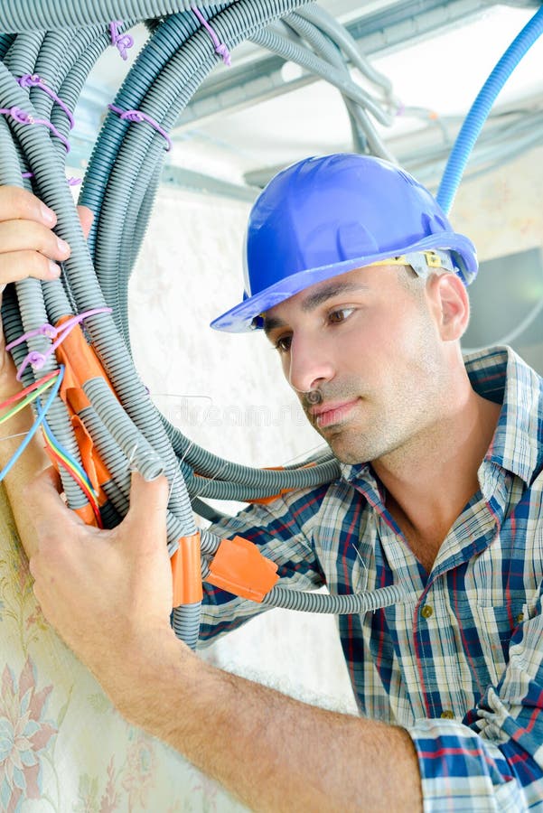 Builder Holding Cables Taped Together Stock Photo - Image of business ...
