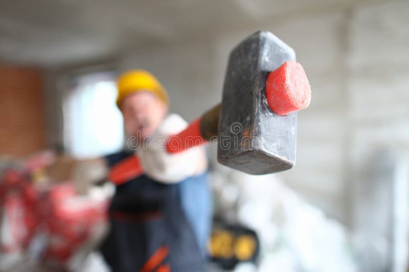 Builder Holding a Construction Hammer at Construction Site Closeup ...