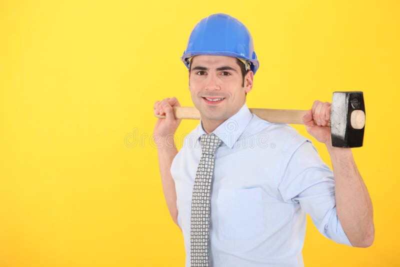 Builder holding hammer stock image. Image of attractive - 27581119