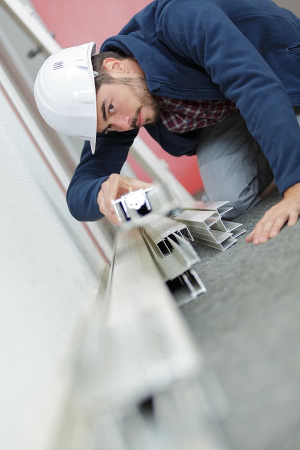 Builder Inspecting Measurements Ordered Materials Stock Photo - Image ...