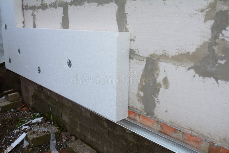 Builder Installing Rigid Styrofoam Insulation Board for Energy Saving ...