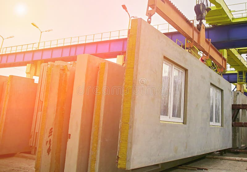 A Builder Installs a Concrete Floor Slab Panel at a Construction Site ...