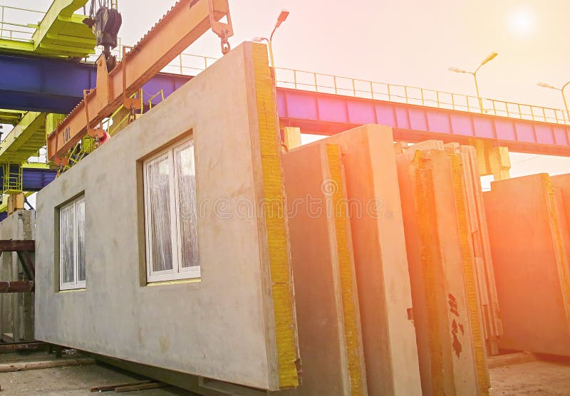 A Builder Installs a Concrete Floor Slab Panel at a Construction Site ...