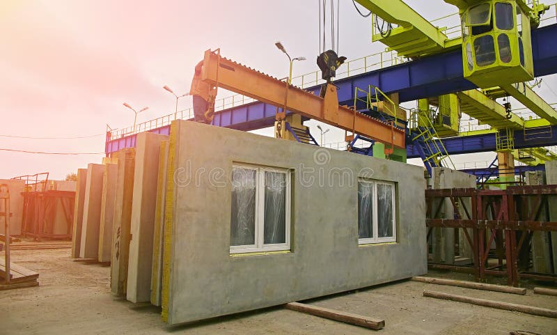 A Builder Installs a Concrete Floor Slab Panel at a Construction Site ...