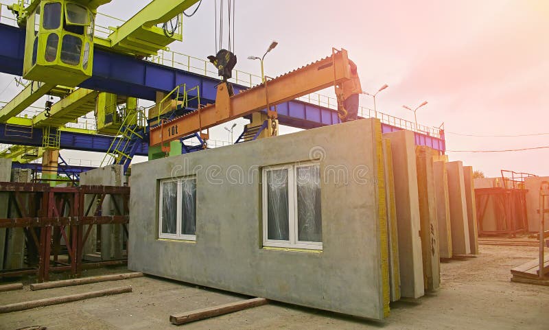 A Builder Installs a Concrete Floor Slab Panel at a Construction Site ...