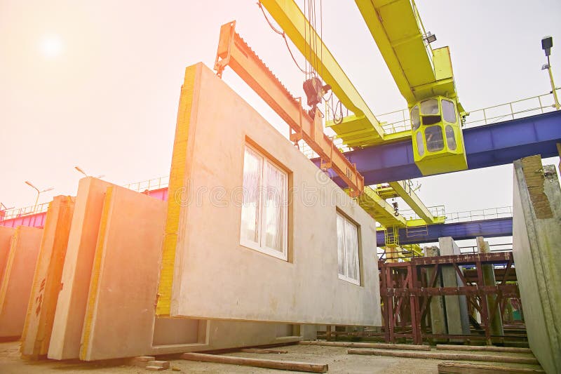 A Builder Installs a Concrete Floor Slab Panel at a Construction Site ...