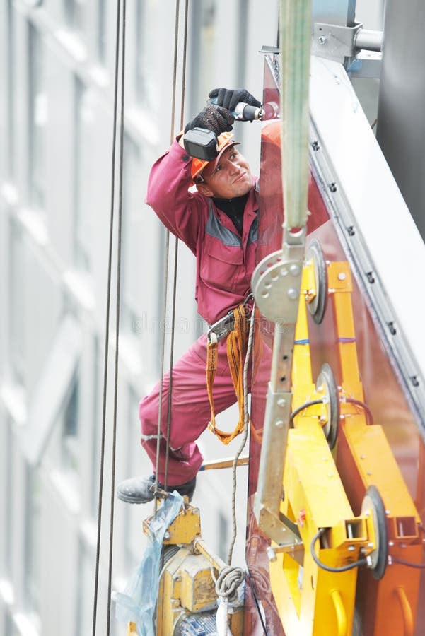 Workers Installing Glass Window on Building Stock Photo - Image of ...