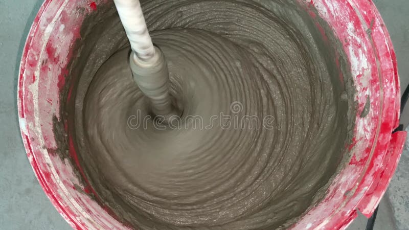 Construction Worker Kneading Dry Mortar with Water Using Mixer. Stock ...