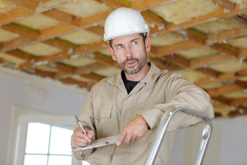 Builder on ladder stock image. Image of construction - 242460587