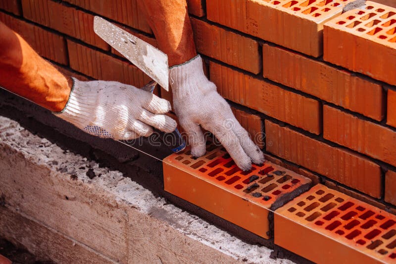 Builder Laying Bricks on Construction Site Stock Image - Image of ...