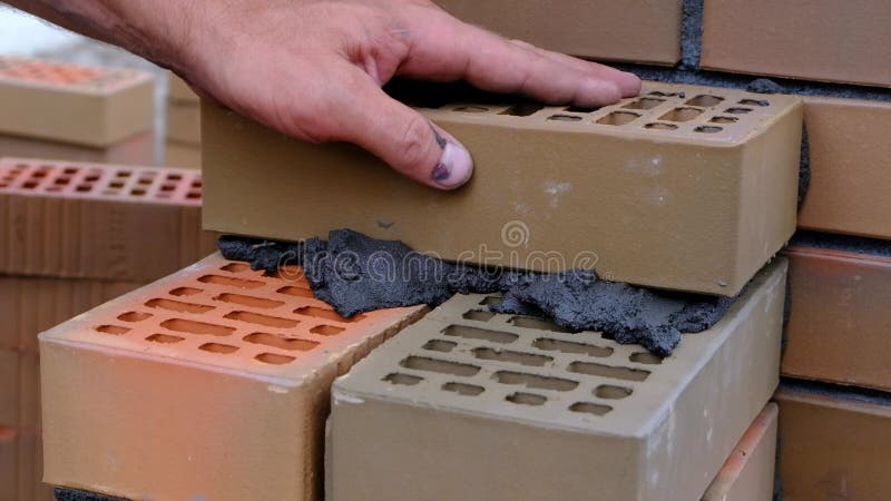 Builder Laying Bricks on Construction Site Stock Video - Video of ...