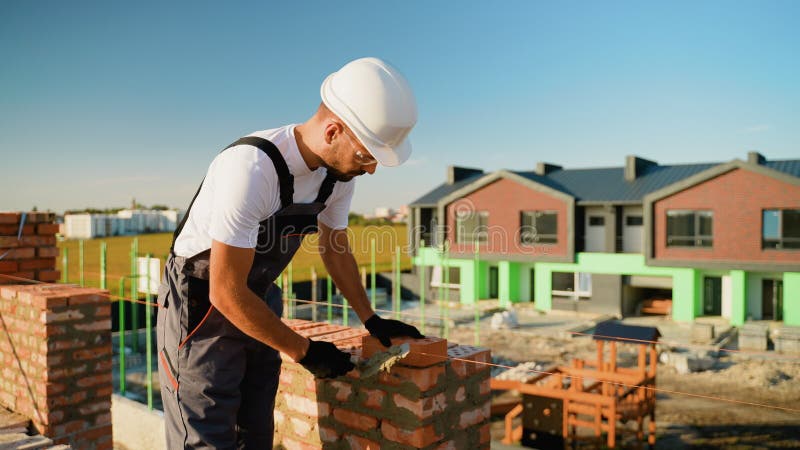 Builder Laying Bricks on Construction Site Stock Video - Video of ...